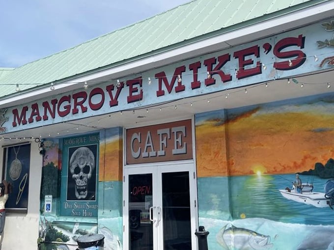 That giant shark statue isn't compensating for anything—Mangrove Mike's food is every bit as impressive as its toothy greeter.