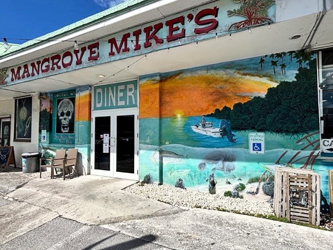 The vibrant exterior of Mangrove Mike's welcomes you with a mural that's pure Florida Keys—where breakfast dreams and underwater scenes collide in technicolor splendor.
