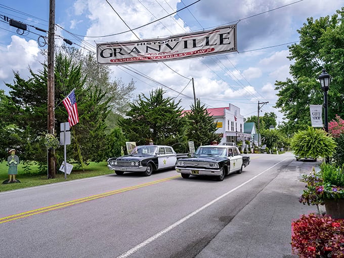 The iconic Granville banner welcomes visitors with vintage police cars parading beneath – small-town Americana that's not staged for tourists but genuinely lived.