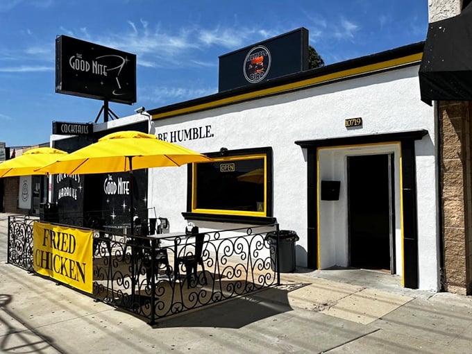 Sunshine, yellow umbrellas, and a simple banner announcing "FRIED CHICKEN" – sometimes the best treasures require the fewest words.