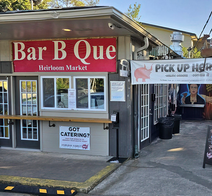 Don't let the humble exterior fool you – this tiny BBQ joint houses flavor explosions that would make NASA engineers jealous. The red "Bar B Que" banner serves as Atlanta's tastiest treasure map.