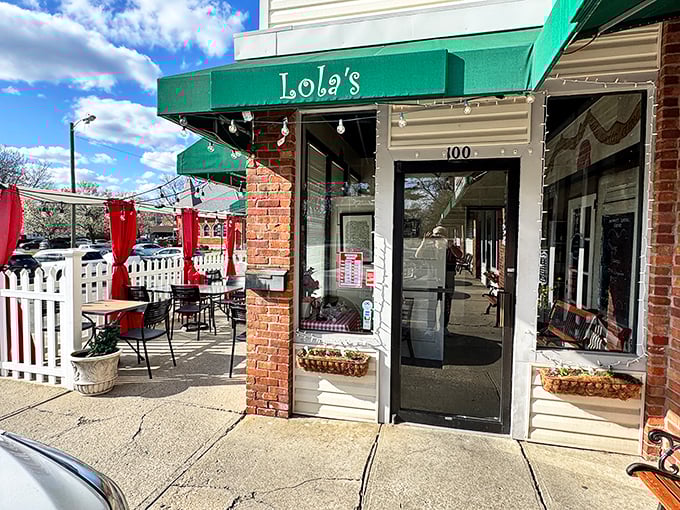 Green awnings and brick charm make this Columbus corner feel like a neighborhood secret worth discovering.