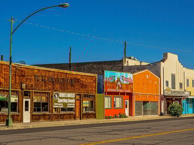 Main Street's colorful storefronts tell a story of small-town resilience, where your dollar stretches further than your average yoga enthusiast.