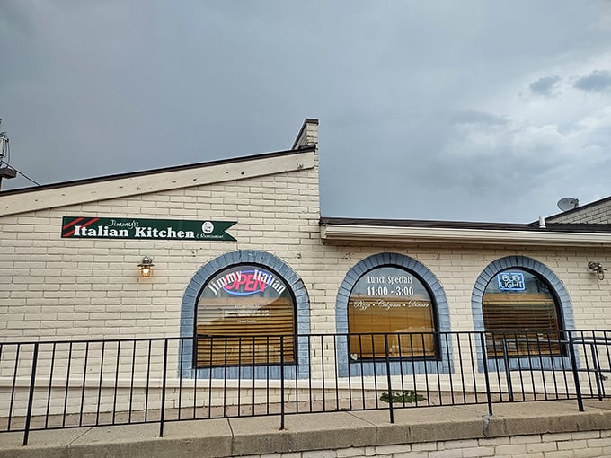The unassuming white brick exterior of Jimmy's Italian Kitchen proves once again that culinary treasures often hide in plain sight.