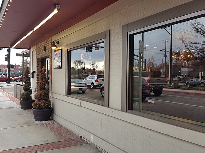 The unassuming exterior of Bodacious Pig belies the flavor explosion waiting inside. Like finding a diamond in a strip mall, this BBQ haven proves appearances can be deliciously deceiving.