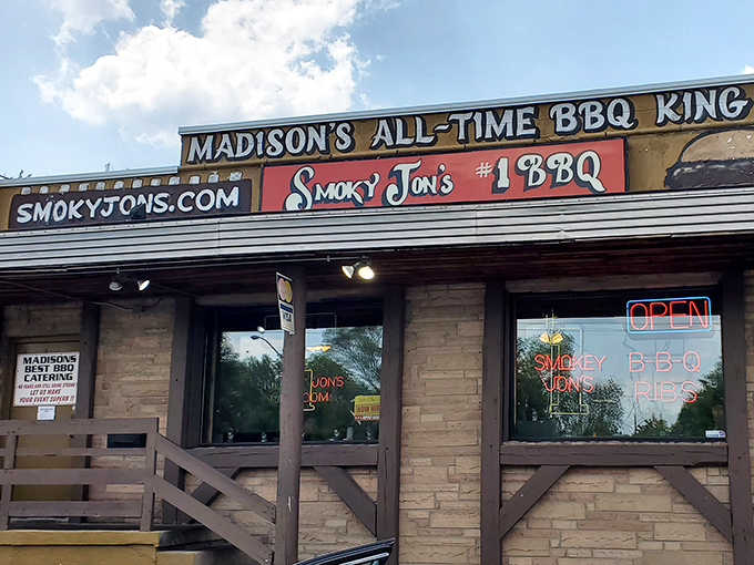 Madison's self-proclaimed BBQ royalty stands proud with its rustic wooden porch and stone facade, beckoning hungry travelers like a smoky siren call.