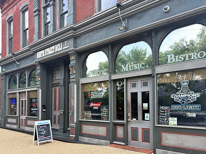 The historic brick façade of Ninth Street Deli @ Howard's promises culinary treasures within. St. Louis sandwich seekers, your quest ends here.