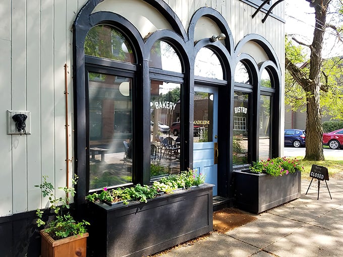 The charming façade with its distinctive arched windows and planters feels like stumbling upon a secret European bakery tucked away in a Pittsburgh neighborhood.