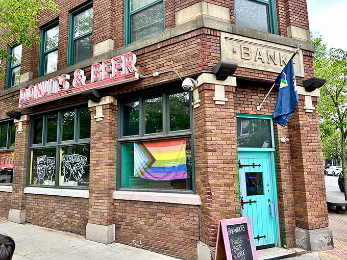 What was once a bank now safeguards something far more valuable: a treasure trove of craft beer and artisanal donuts behind that eye-catching turquoise door.