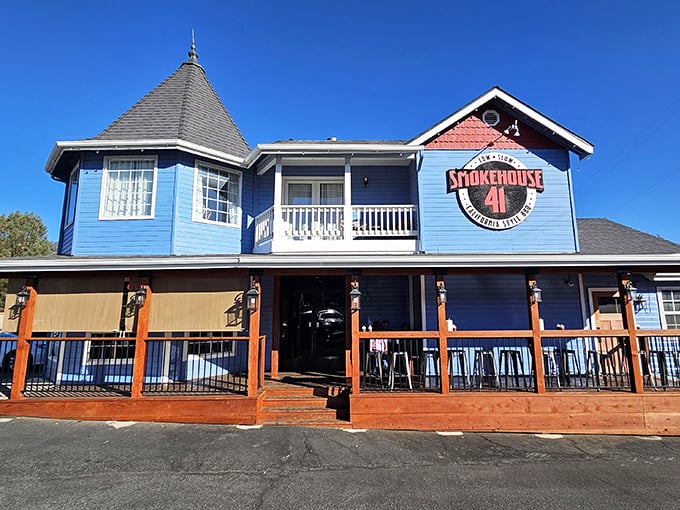 The bright blue Victorian-style building stands out like a barbecue beacon against the Sierra Nevada sky, promising smoky delights within.