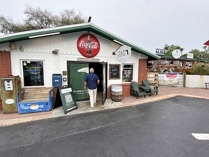 The humble exterior of Florida Cracker Kitchen beckons with rocking chairs and that iconic green door—like a friend's porch that happens to serve incredible food.