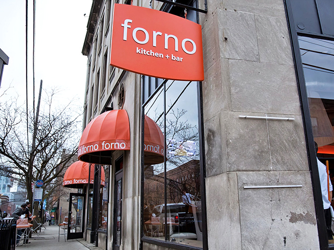 That vibrant orange sign isn't just eye-catching—it's a beacon of culinary delight in Columbus's Short North district. Food paradise, straight ahead!