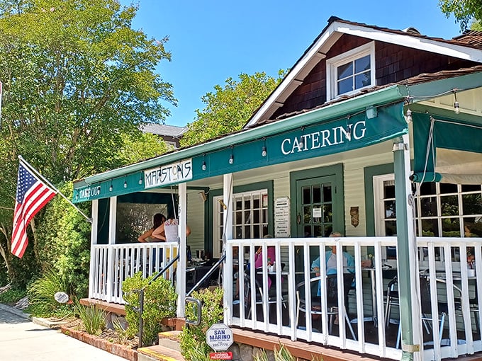A charming Craftsman bungalow transformed into breakfast paradise, Marston's welcomes you with a white picket fence and American flag—home before you even walk in.