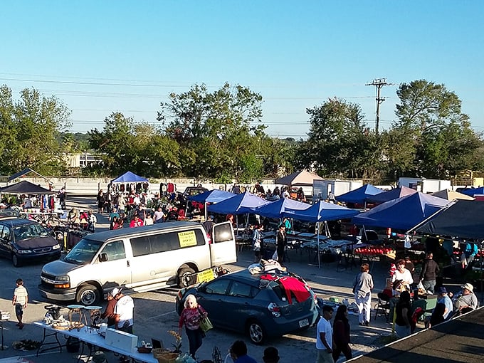 The Silver Moon sprawls across acres of asphalt, a treasure hunter's paradise where blue canopies create an impromptu cityscape of commerce and curiosity.