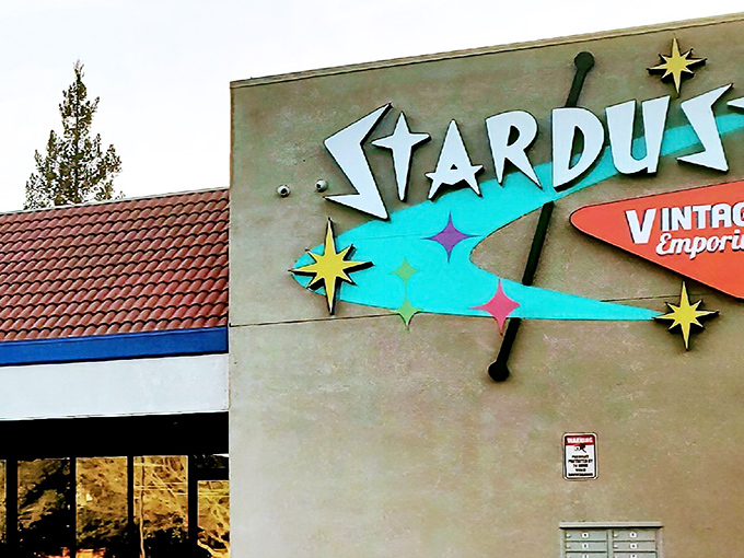 A closer look at that atomic-age signage—pure vintage eye candy! Those colorful stars practically wink at you, promising nostalgic delights inside.
