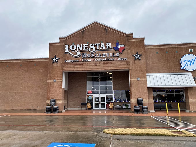 The brick facade of Lone Star Mercantile stands like a temple to Texas treasures, complete with iconic stars flanking the entrance—vintage hunting paradise awaits inside.