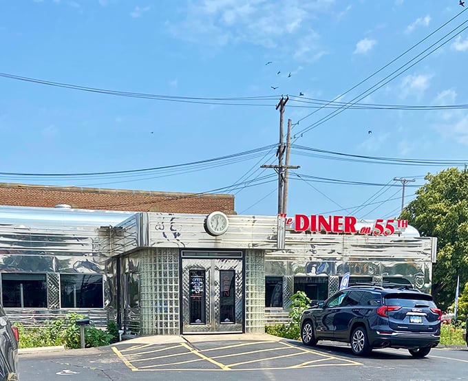 The gleaming stainless steel exterior of The Diner on 55th stands like a time capsule under the Cleveland sky, beckoning hungry travelers with its classic Americana charm. 