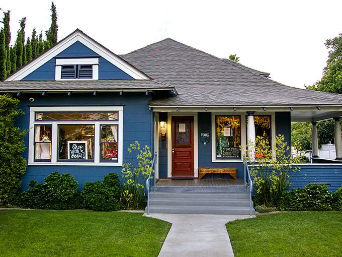 This cozy blue craftsman cottage feels more like a fashionable friend's home than a thrift store — but inside, you’ll find curated secondhand gems and stylish surprises at every turn.