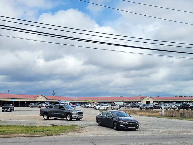 The sprawling exterior of Barnyard Flea Market beckons treasure hunters with its no-frills charm and packed parking lot—weekend adventures await inside!