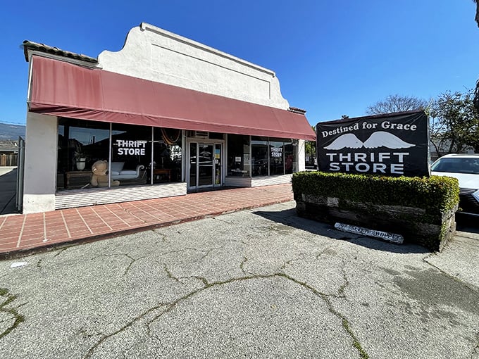 Classic California architecture meets thrift store magic under that distinctive red awning—where the real treasures await just beyond those glass doors.