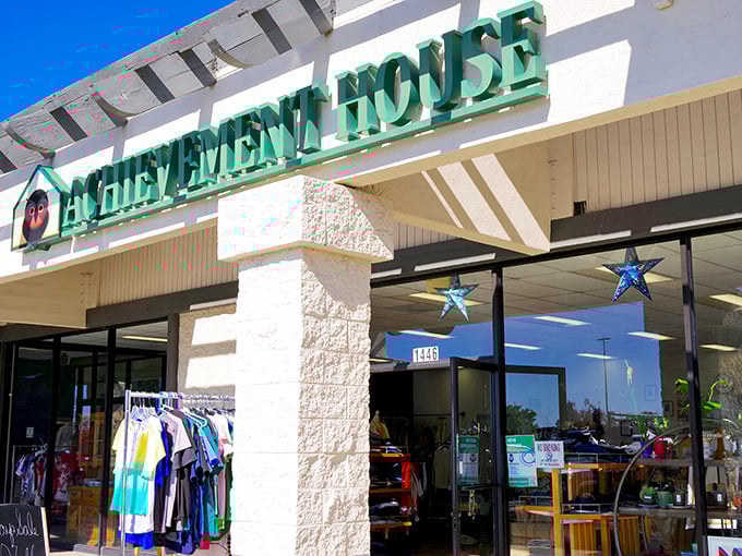 The welcoming storefront of Achievement House beckons with its cheerful owl logo—like a wise old friend inviting you to discover hidden treasures inside.