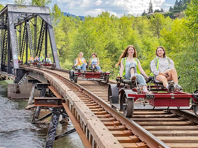 Rail biking across this historic trestle bridge feels like starring in your own adventure movie—part workout, part sightseeing, all magic.