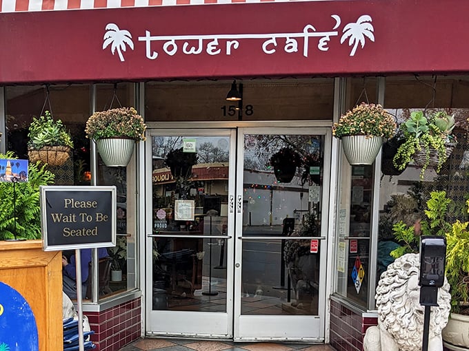The entrance to Tower Café beckons like a tropical oasis in Sacramento, complete with hanging plants and a stone lion standing guard at flavor's doorstep.