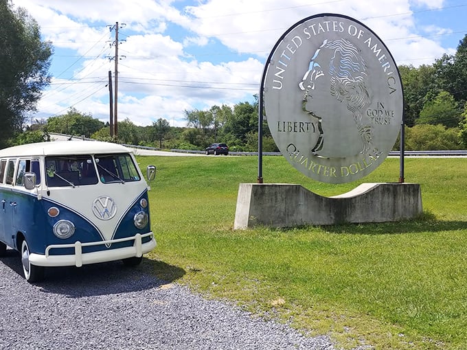 Nothing says "I found some change" quite like posing with a quarter the size of a VW bus. Classic Americana at its most delightfully absurd.