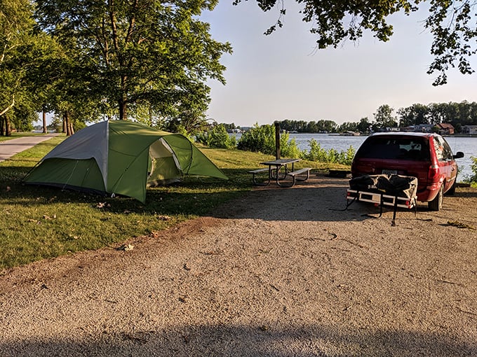 Lakeside camping perfection – where your morning coffee comes with a side of spectacular water views and the promise of adventure.