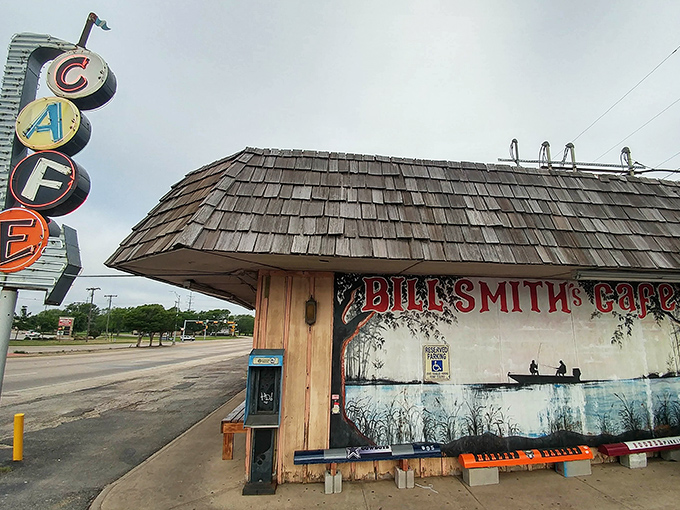 The iconic mural outside Bill Smith's Cafe tells you everything you need to know—this place values fishing, food, and small-town charm equally.