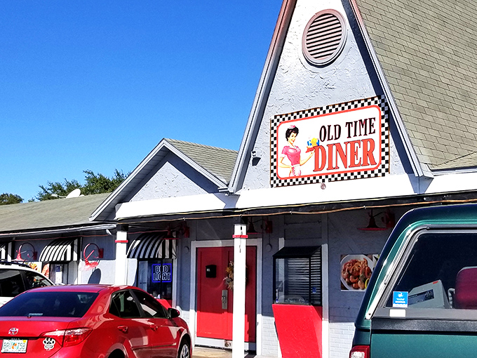 That iconic A-frame entrance isn't just architecture—it's a time machine disguised as a diner, complete with checkerboard trim that screams "Elvis might eat here."