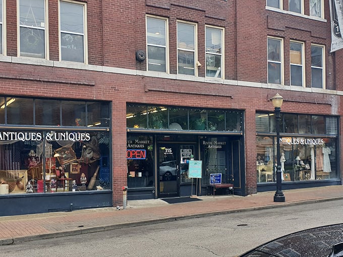 The unassuming storefront of River Market Antiques beckons with its classic neon "OPEN" sign—a portal to treasures spanning decades of American life.