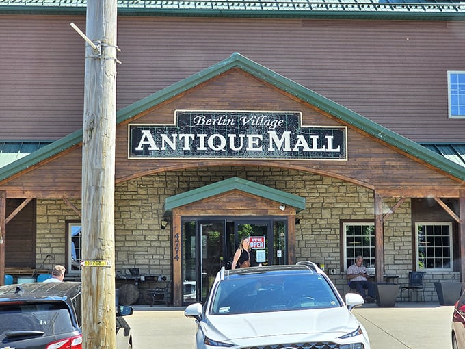 The rustic charm of Berlin Village Antique Mall's exterior promises treasures within—like a time capsule disguised as a building in Amish Country.