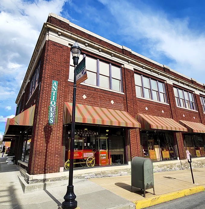 The historic brick façade of Burning Bridge Antique Market stands proudly in Columbia, its colorful awnings beckoning vintage hunters like a siren song for the nostalgic soul.