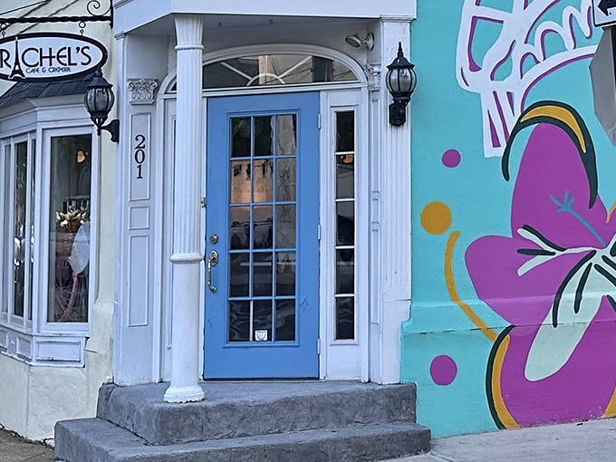 That iconic blue door isn't just an entrance—it's a portal to crepe paradise. The colorful mural beside it hints at the creativity waiting inside.