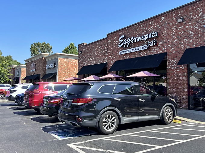The brick exterior of Eggstravaganza Cafe promises little, delivers everything. Those packed parking spaces tell the real story—breakfast worth getting dressed for.
