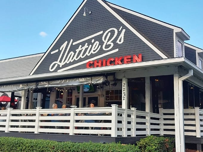 The black-and-white facade with that bold red "CHICKEN" sign isn't just architecture—it's Nashville's equivalent of a lighthouse guiding hungry souls to spicy salvation.