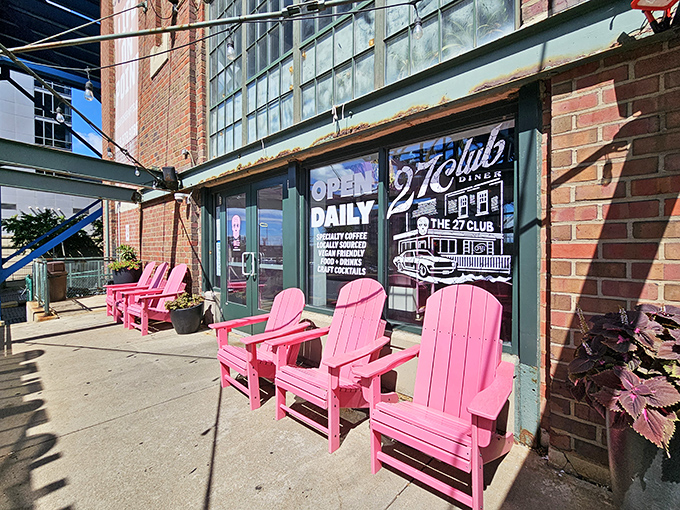 Those pink Adirondack chairs aren't just seating—they're an invitation to slow down and savor Cleveland's evolving cityscape with coffee in hand.