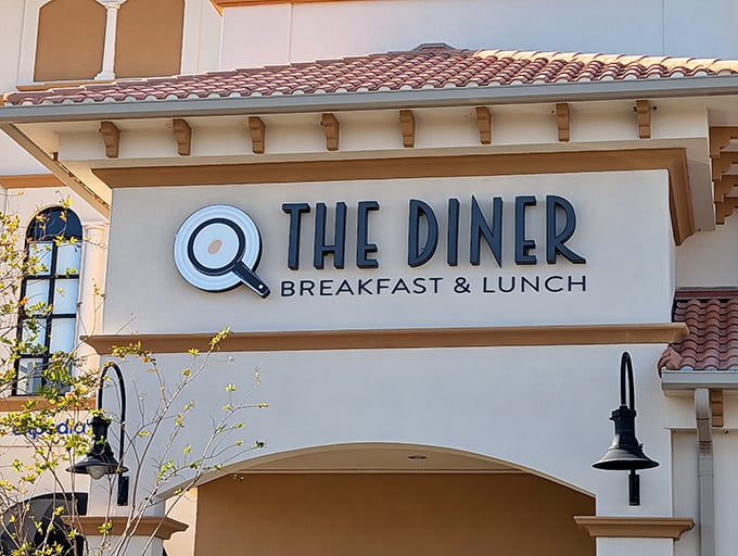 The Spanish-inspired façade of @ The Diner beckons like a breakfast beacon on Universal Boulevard, promising morning delights that'll make you forget theme park food exists.