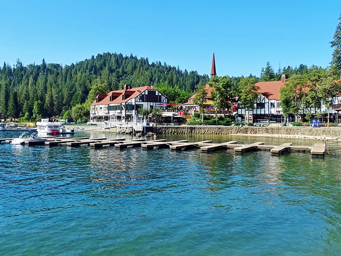 The quintessential Lake Arrowhead view—Tudor-style buildings nestled against emerald pines with that impossibly blue water. Mother Nature showing off again.