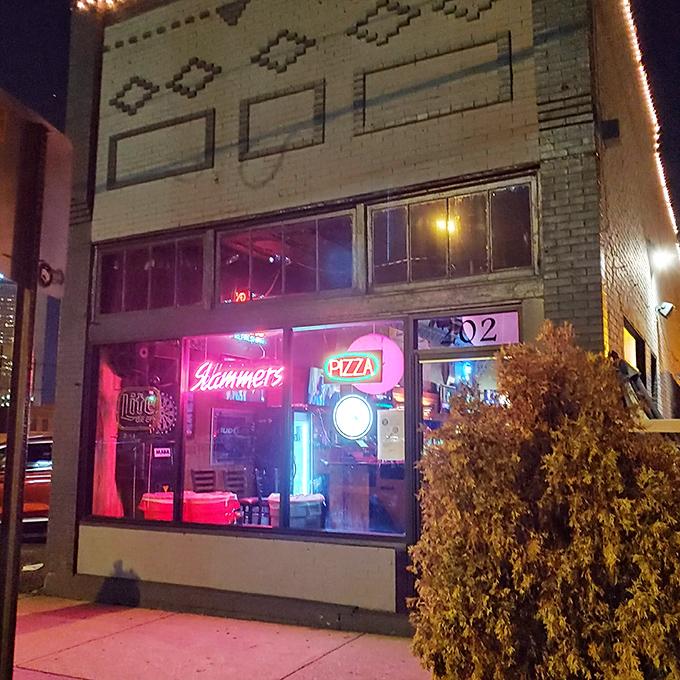 The neon glow of Slammers beckons like a lighthouse for the pizza-starved souls of Columbus. This brick facade hides treasures within.