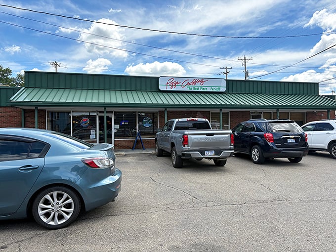 The modest green-roofed front of Pizza Crossing may not turn heads, but locals know its brick walls conceal flavor gems waiting to be savored.