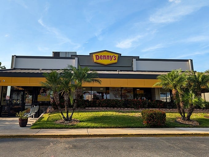 The iconic yellow sign beckons like a lighthouse for hungry travelers on International Drive, promising comfort food and air conditioning – Florida's true treasures.