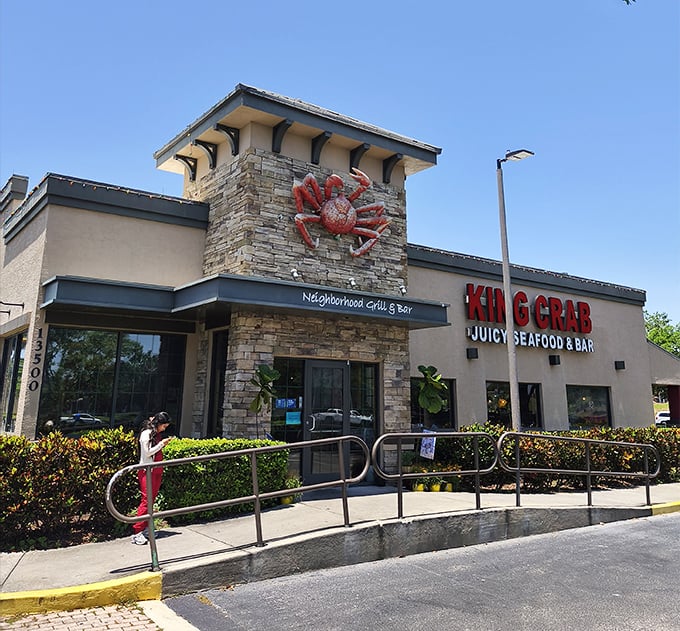 The giant red crab clinging to the stone facade isn't just decoration—it's a siren call to seafood lovers everywhere.
