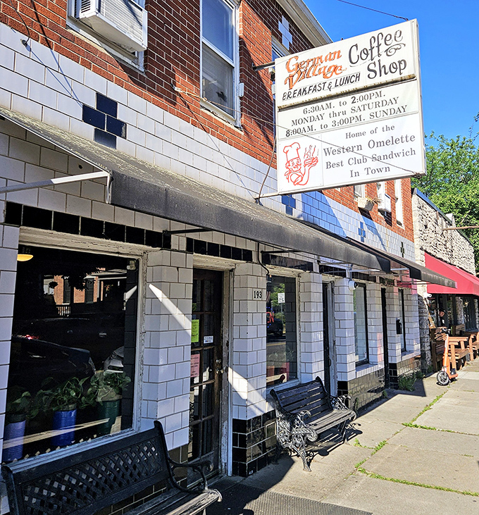 The white-tiled facade and vintage signage of German Village Coffee Shop stands as a time capsule in Columbus, promising comfort food that transcends trends.