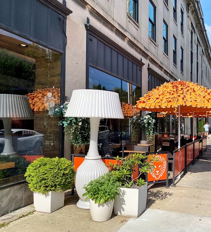That vibrant orange sign isn't just eye-catching—it's a beacon of culinary delight in Columbus's Short North district. Food paradise, straight ahead!