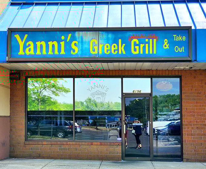 The bright blue awning of Yanni's Greek Grill stands as a Mediterranean beacon in Columbus, promising authentic flavors that transport you straight to the Aegean.