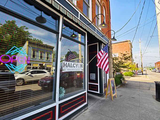 Harbor Halcyon's historic brick façade stands proudly on Ashtabula's Bridge Street, where an American flag waves welcome to hungry visitors seeking culinary refuge.