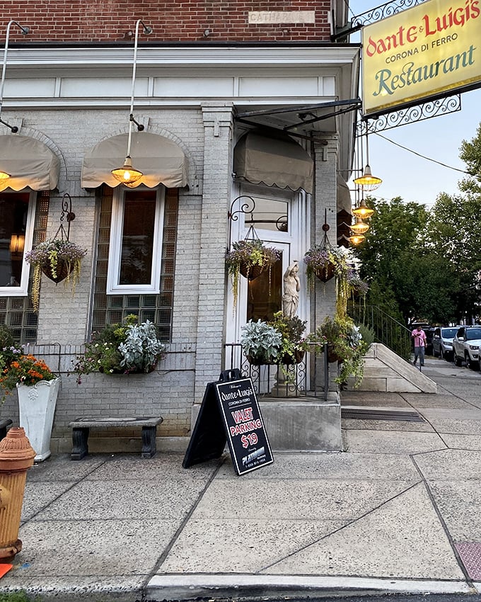 A closer look at the entrance reveals meticulous details—hanging plants, warm lighting, and a welcoming bench that says, "Sit a while, what's the rush?"