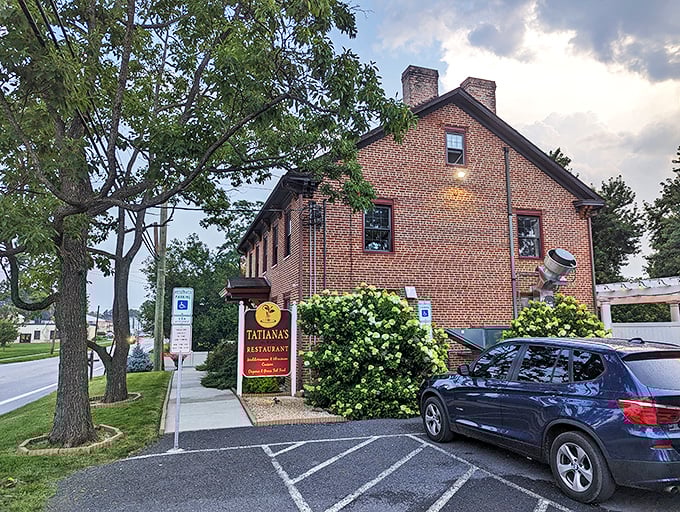 Tatiana's burgundy sign against classic brick architecture creates the perfect first impression—like finding a European postcard come to life in central Pennsylvania.